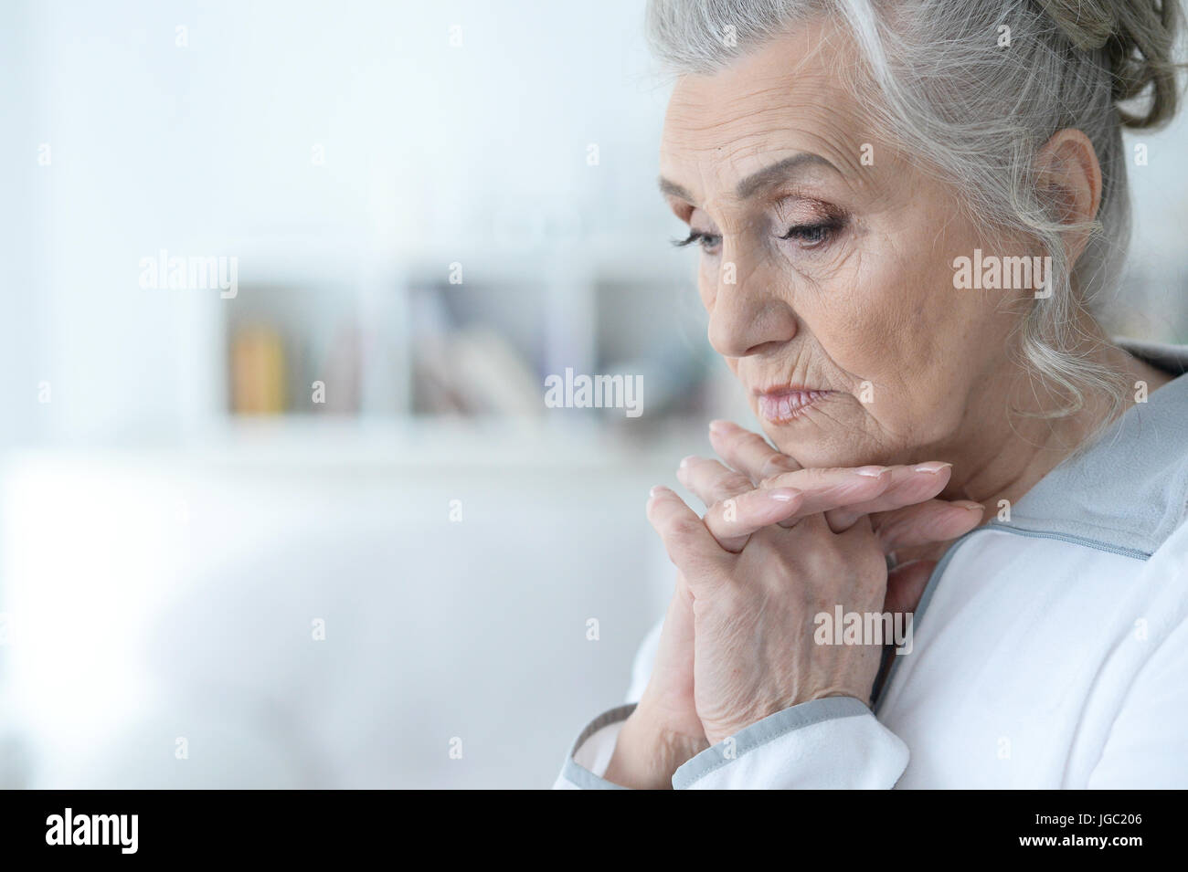 Beautiful sad elderly woman Stock Photo - Alamy