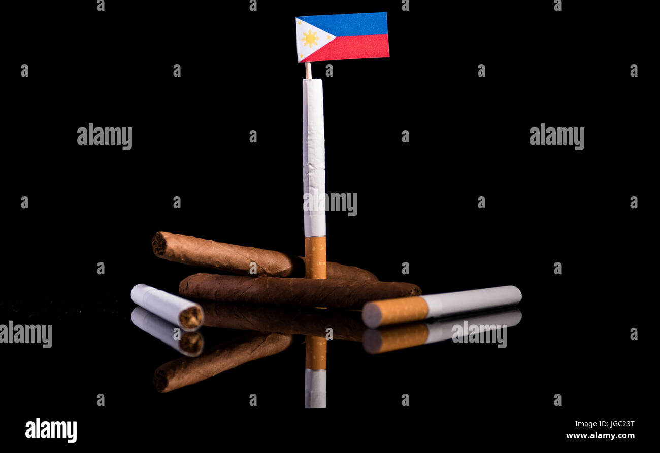 Philippines flag with cigarettes and cigars. Tobacco Industry concept ...