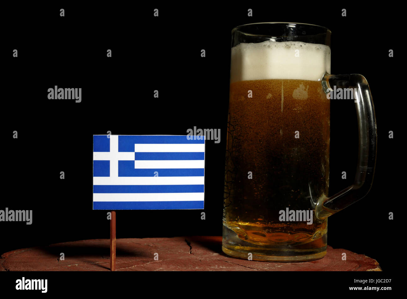 Greek flag with beer mug isolated on black background Stock Photo - Alamy