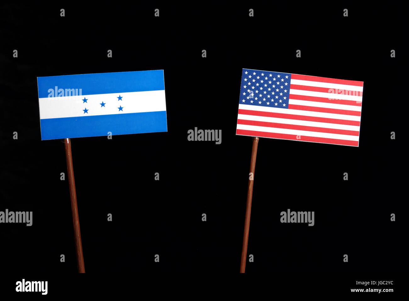 Honduras flag with USA flag isolated on black background Stock Photo ...