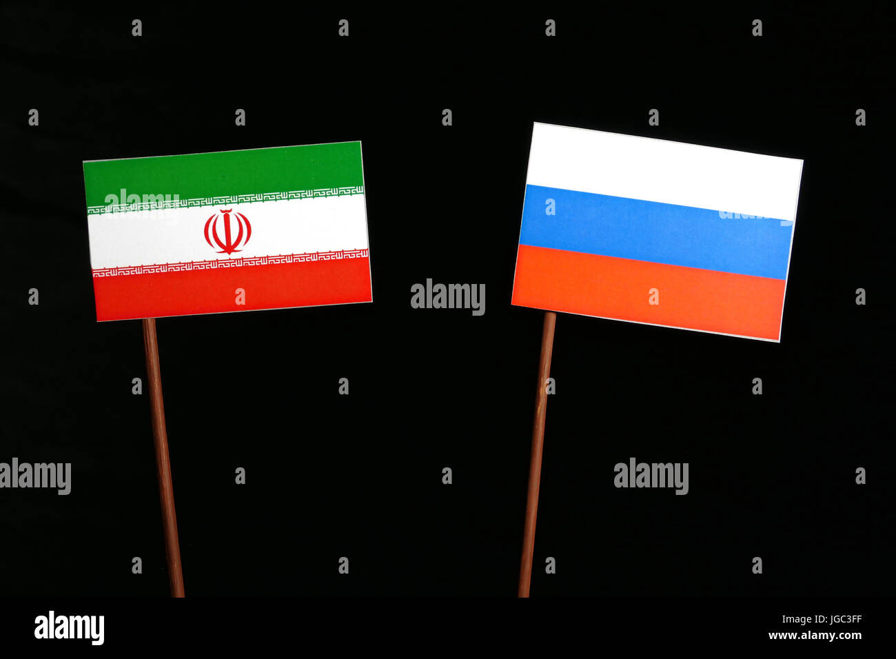 Iranian flag with Russian flag isolated on black background Stock Photo ...