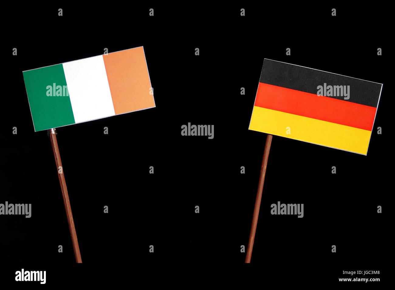 Irish flag with German flag isolated on black background Stock Photo ...