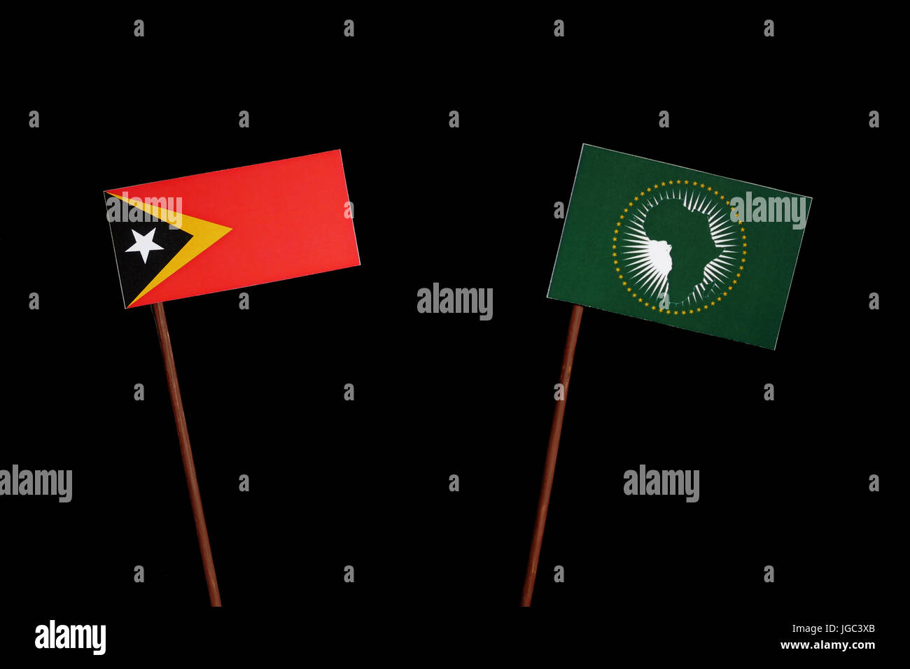 East Timorese flag with African Union flag isolated on black background ...