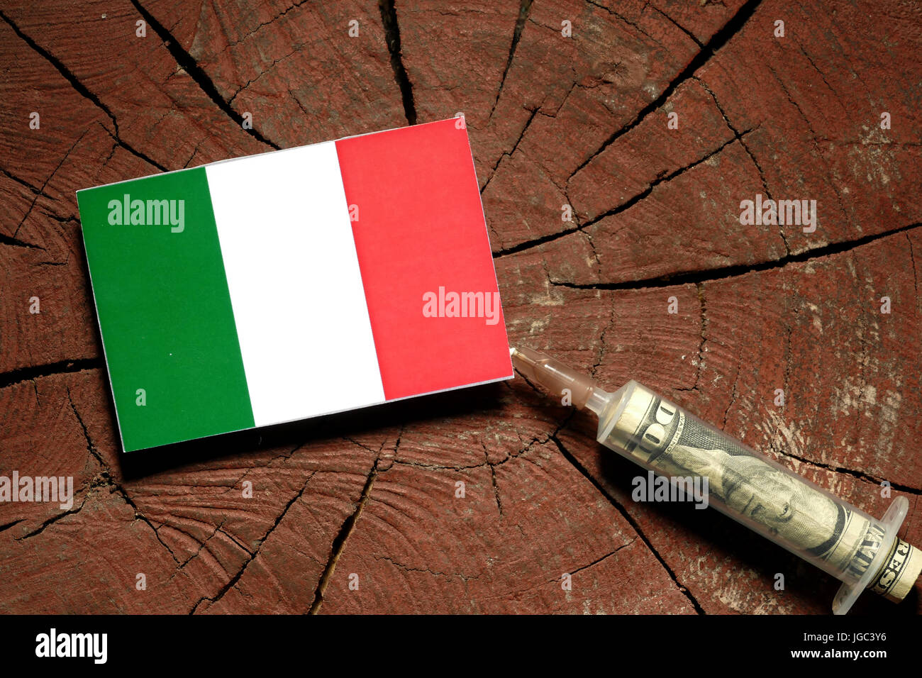 Italian flag on a stump with syringe injecting money in flag Stock ...