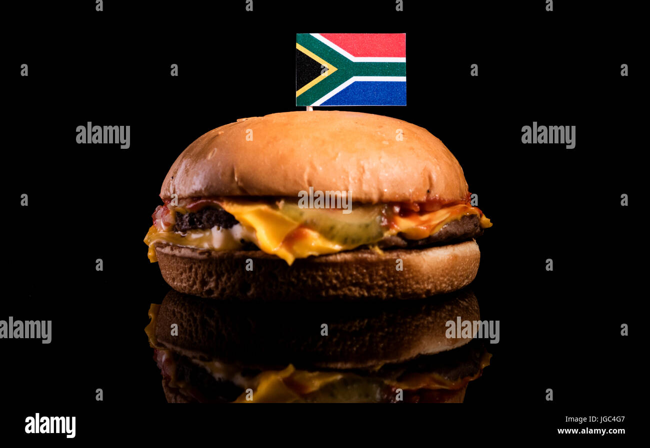 South African flag on top of hamburger isolated on black background ...