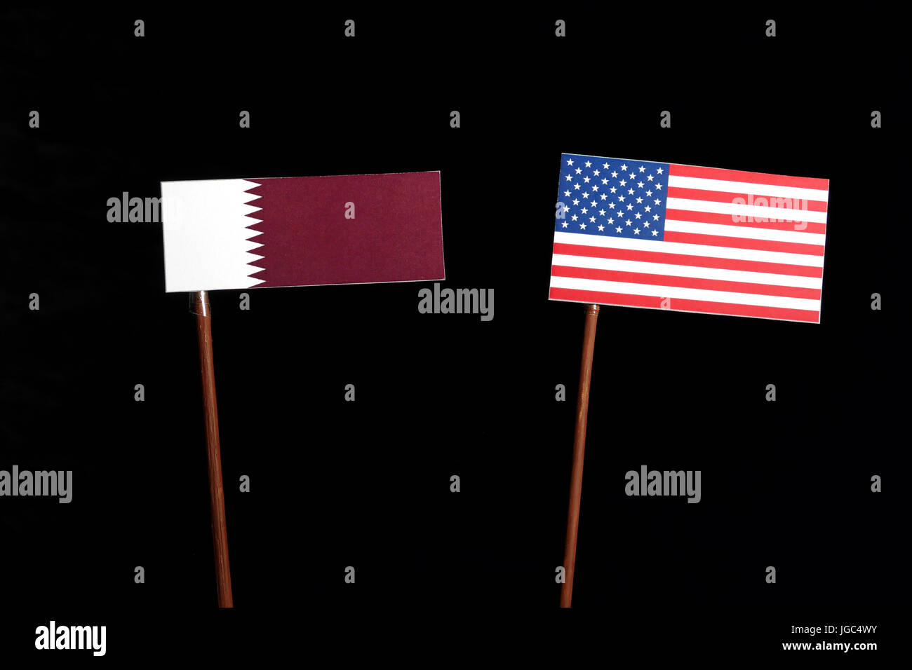 Qatari flag with USA flag isolated on black background Stock Photo - Alamy