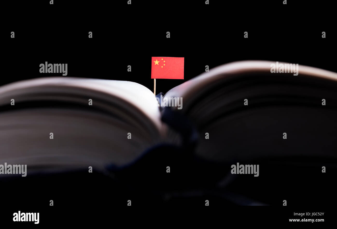 Chinese flag in the middle of the book. Knowledge and education concept ...