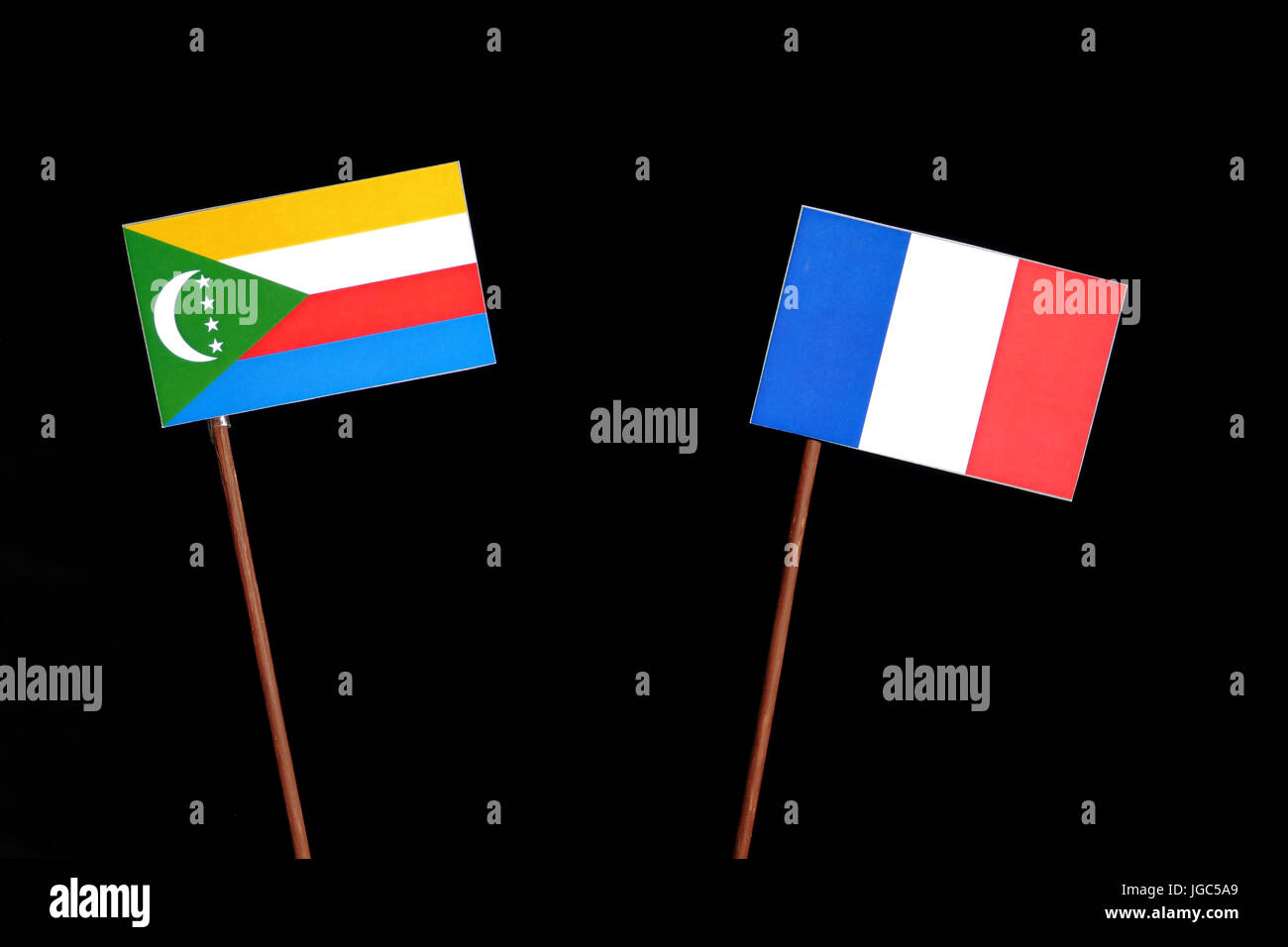 Comoros flag with French flag isolated on black background Stock Photo ...