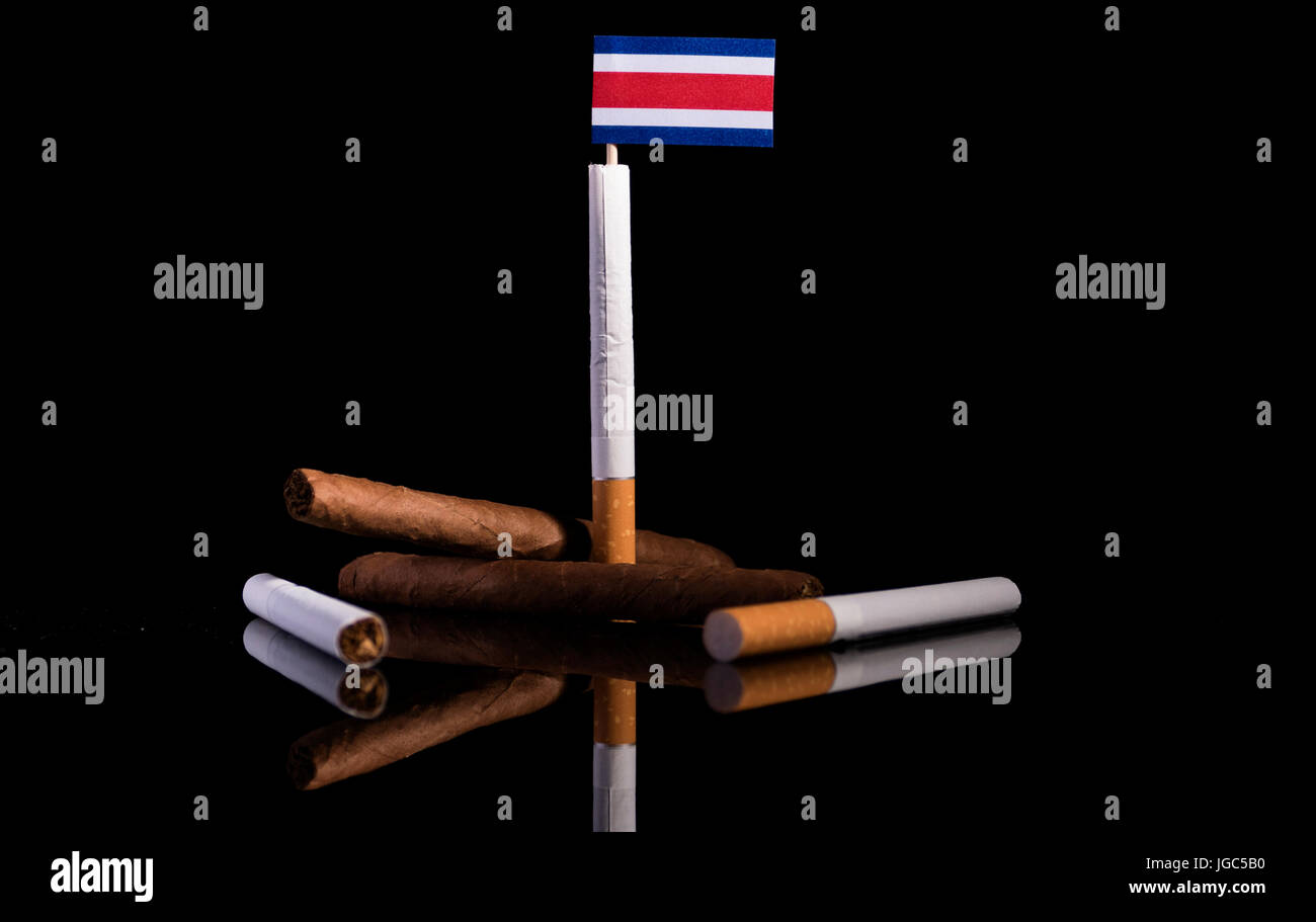 Costa Rican flag with cigarettes and cigars. Tobacco Industry concept ...