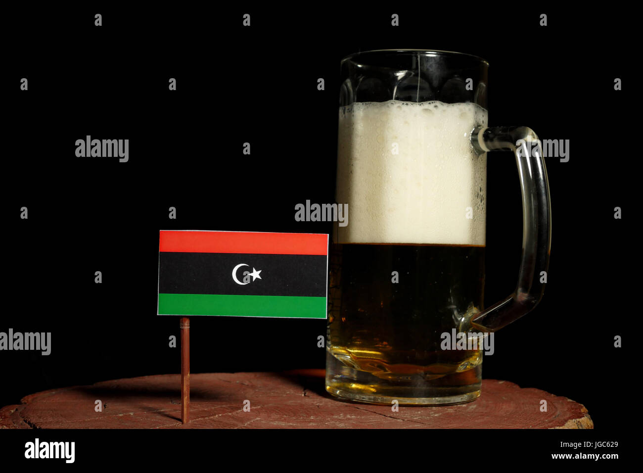 Libyan flag with beer mug isolated on black background Stock Photo - Alamy