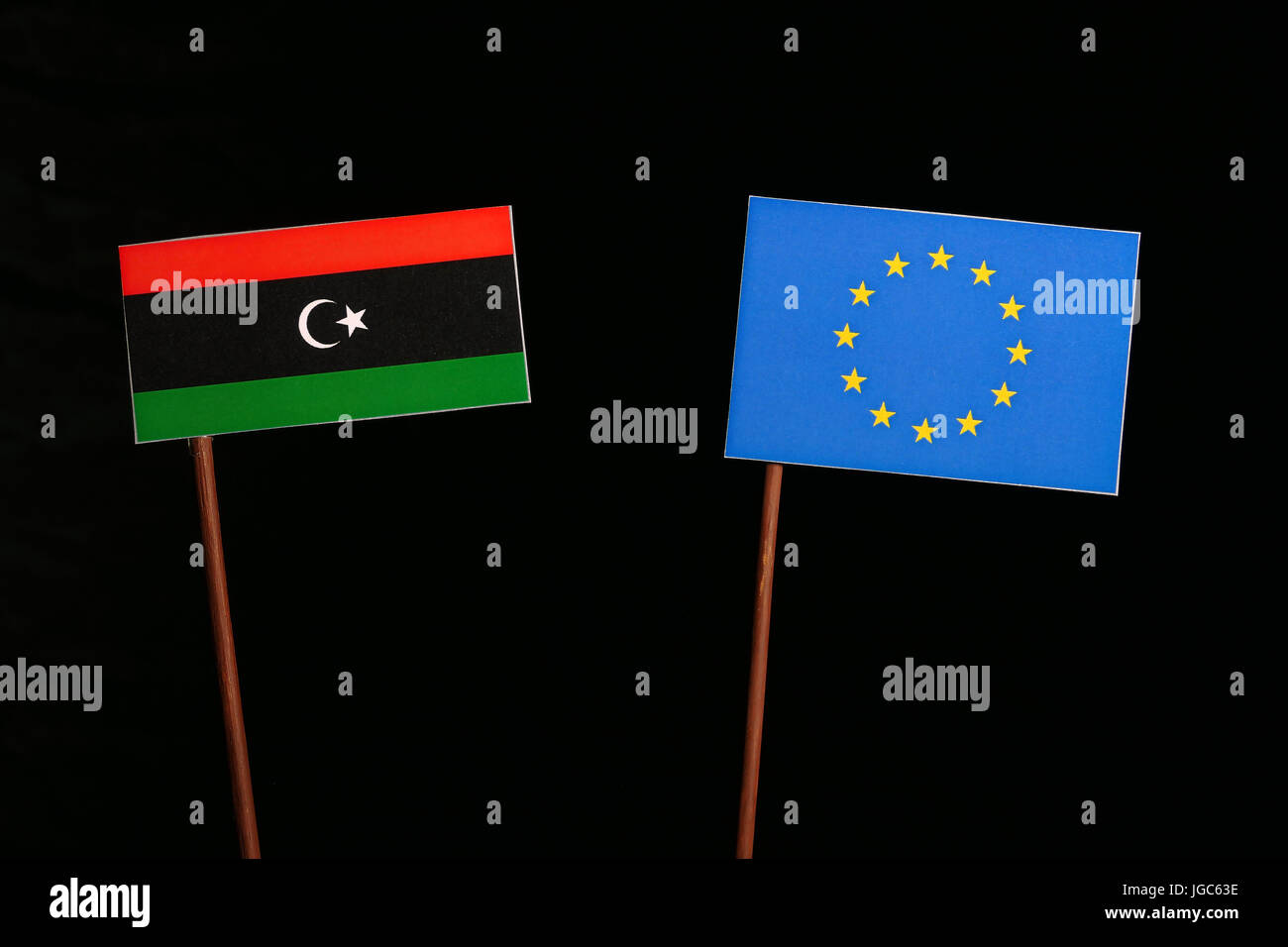 Libyan flag with European Union (EU) flag isolated on black background ...