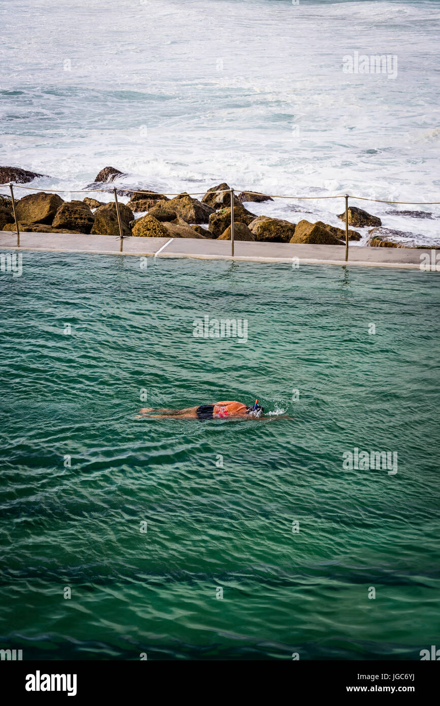 Person swimming in a pool next to the ocean at Bronte Beach, Eastern ...