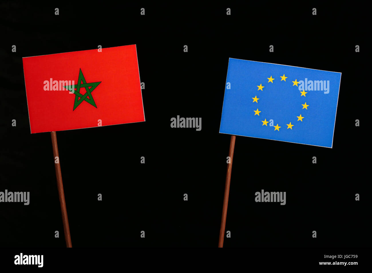 Moroccan flag with European Union (EU) flag isolated on black ...
