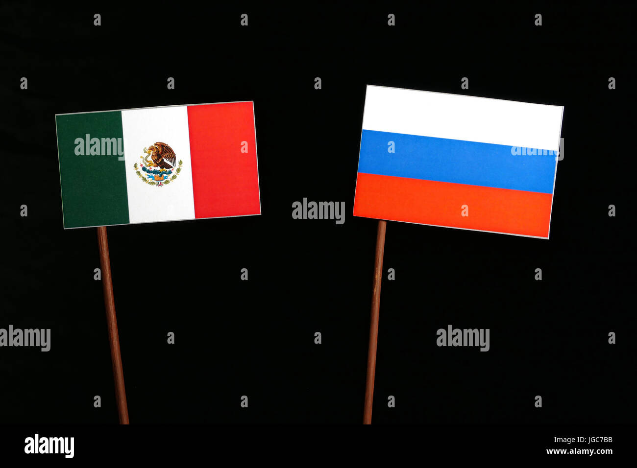 Mexican flag with Russian flag isolated on black background Stock Photo ...