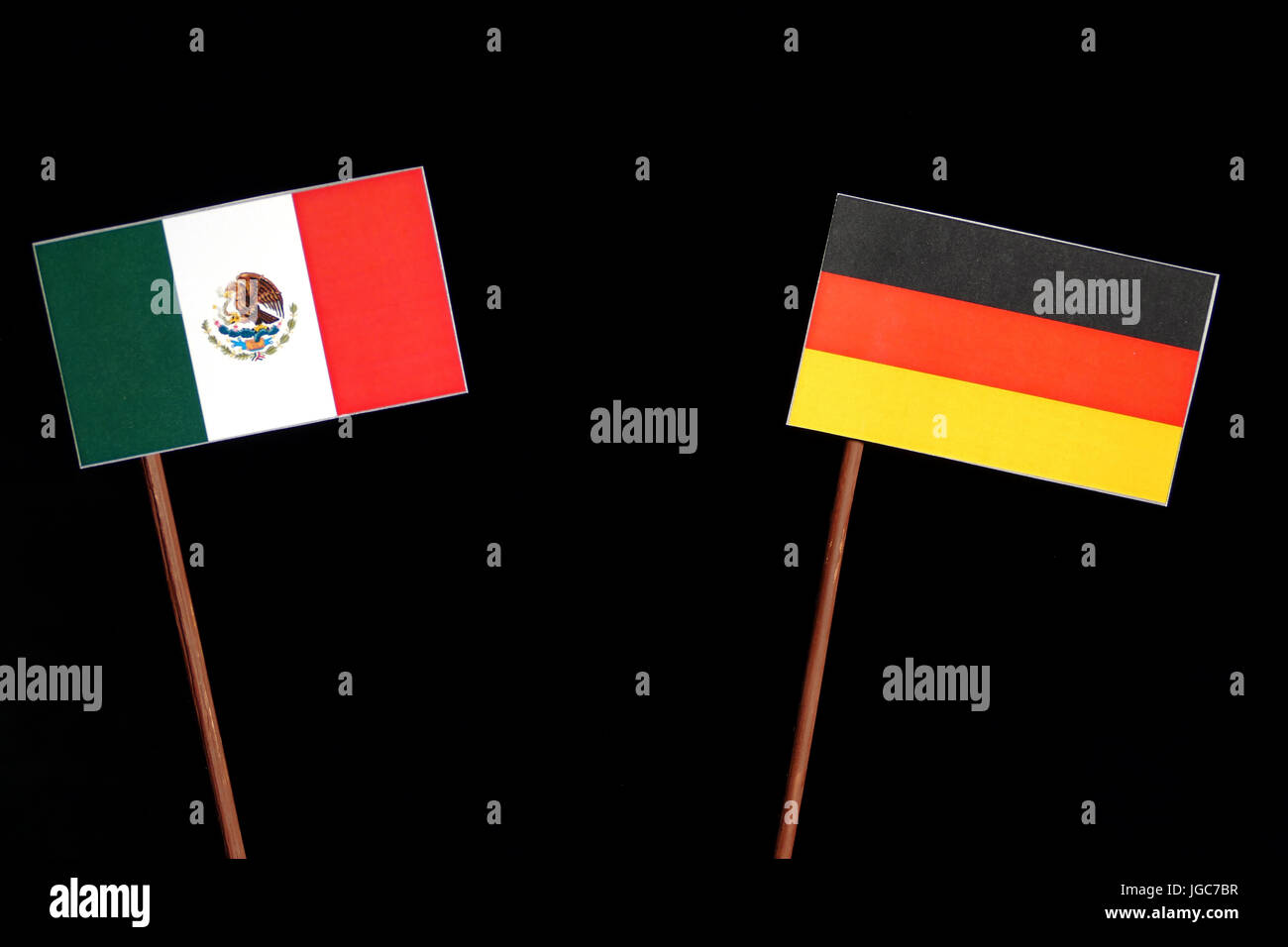 Mexican flag with German flag isolated on black background Stock Photo ...