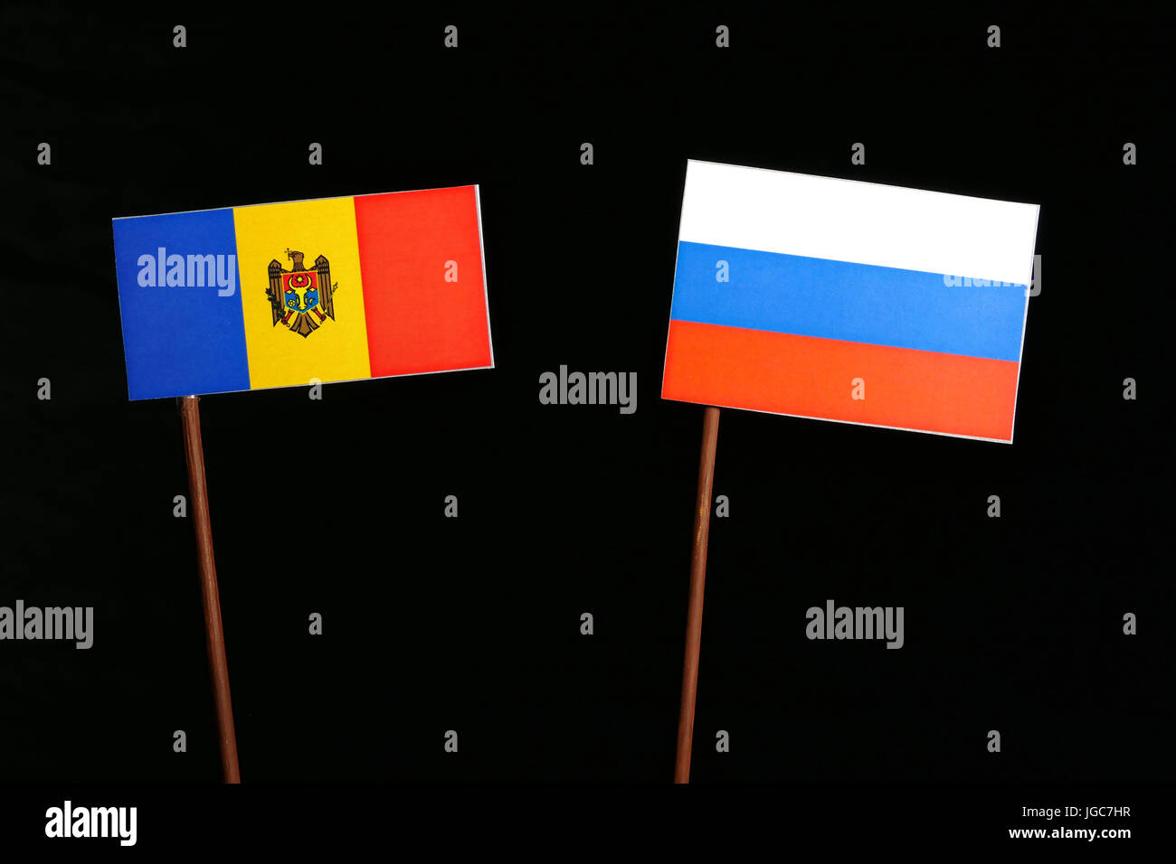 Moldovan flag with Russian flag isolated on black background Stock ...