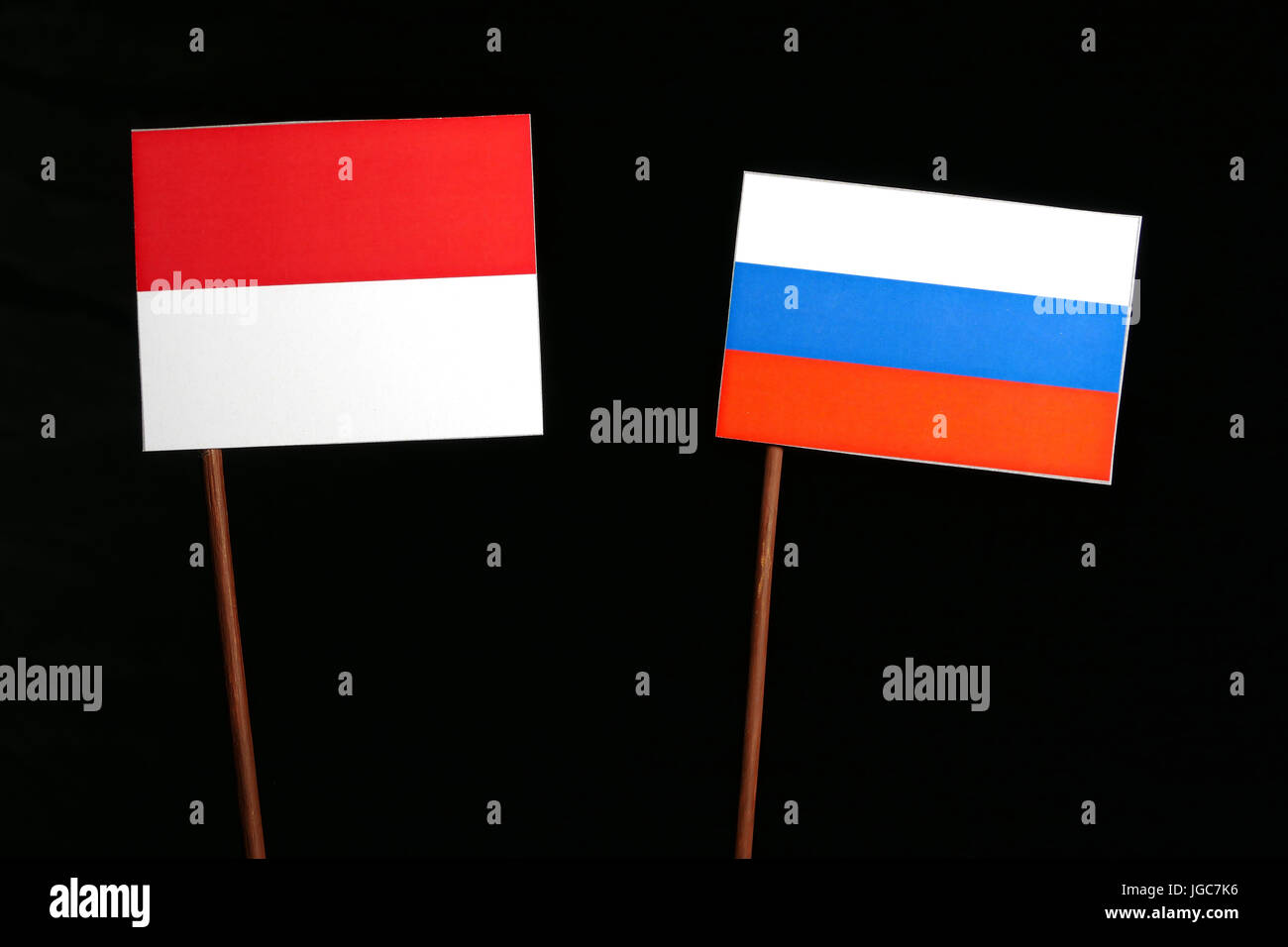 Monaco flag with Russian flag isolated on black background Stock Photo ...