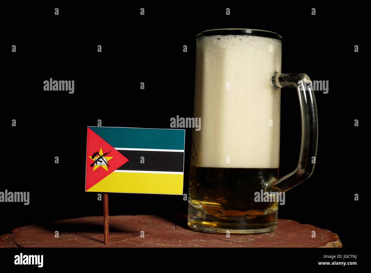Mozambique flag with beer mug isolated on black background Stock Photo ...