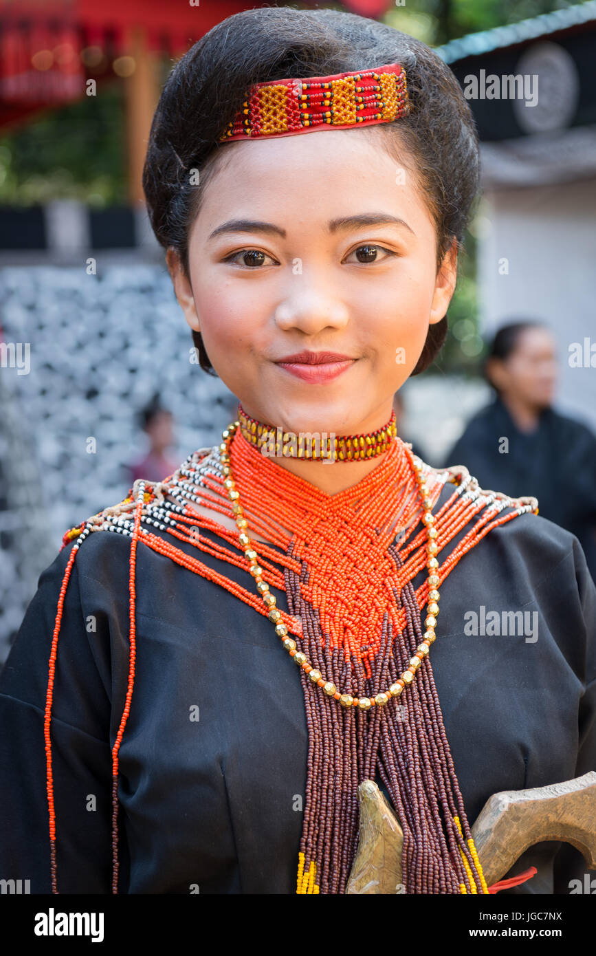 Portrait of a Torajan woman, traditionally dressed for a funeral ...