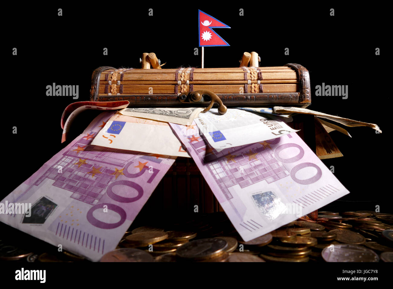Nepali flag on top of crate full of money Stock Photo - Alamy