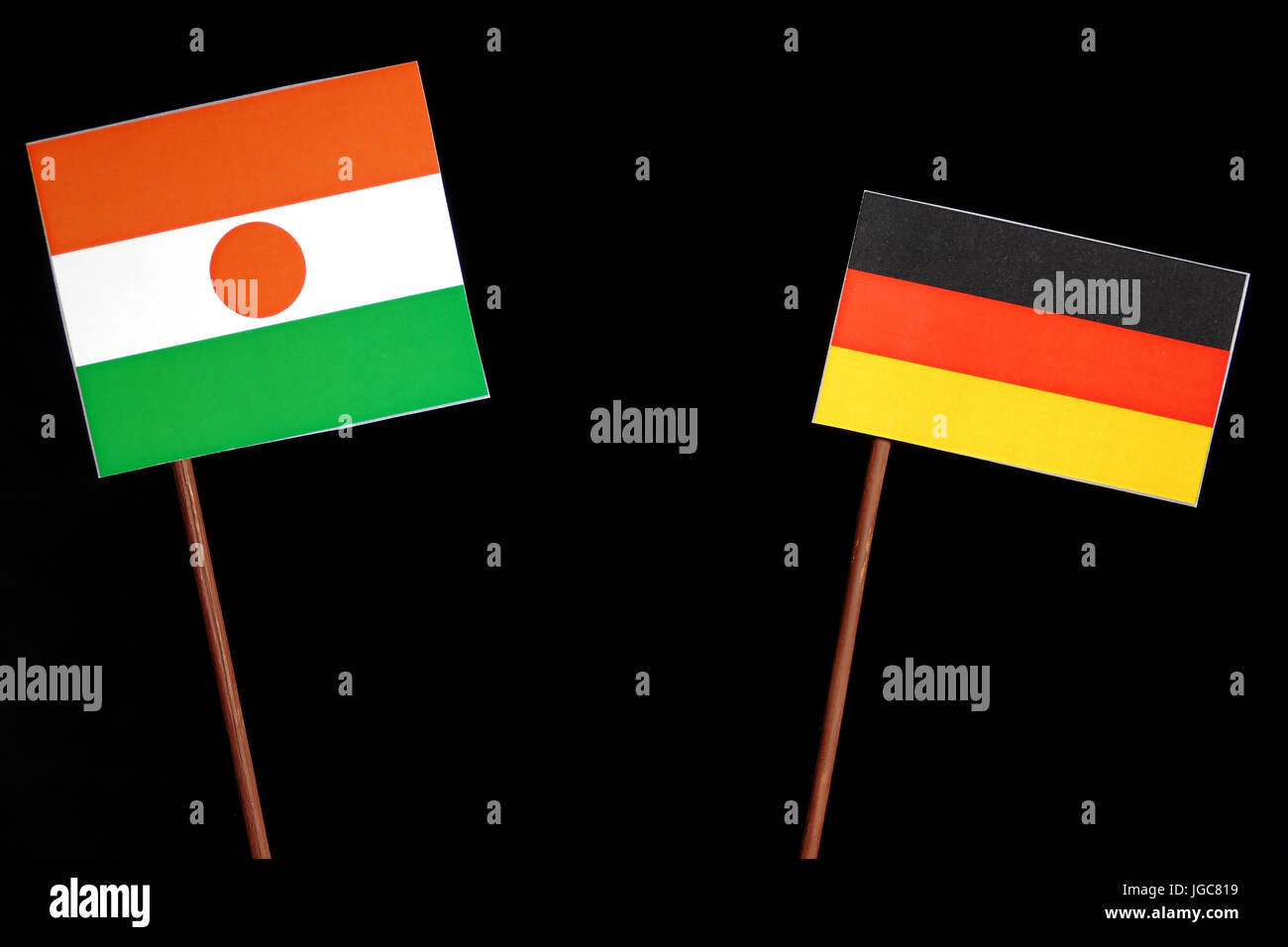 Niger flag with German flag isolated on black background Stock Photo ...