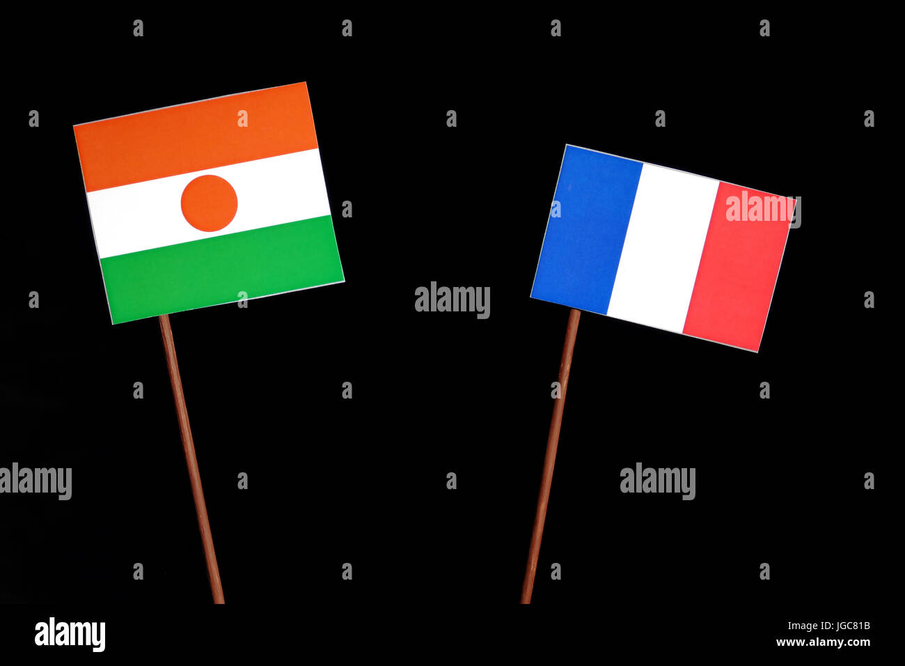 Niger flag with French flag isolated on black background Stock Photo ...