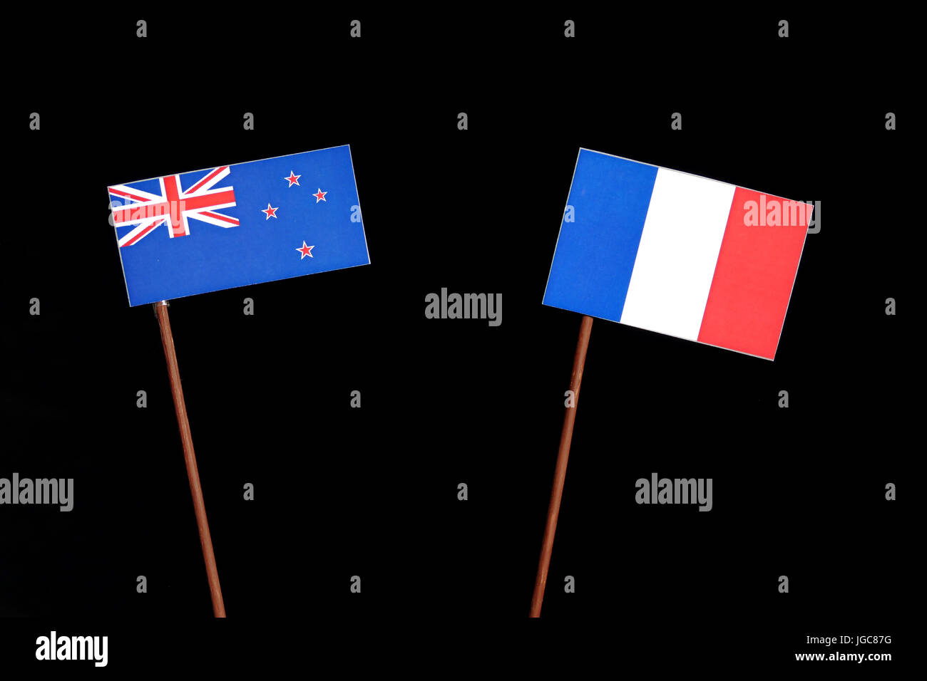 New Zealand flag with French flag isolated on black background Stock ...