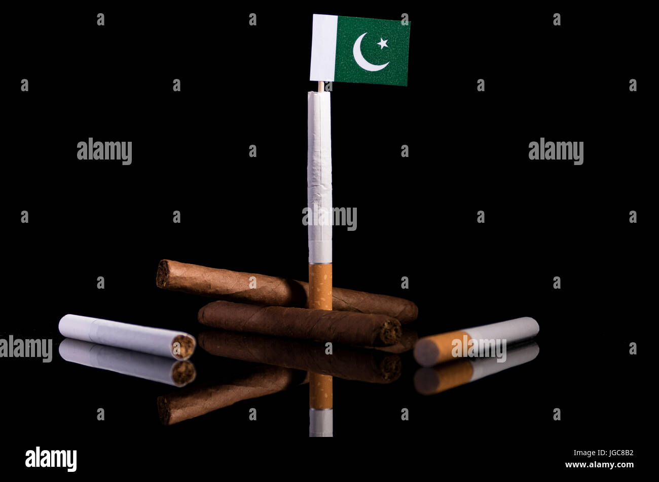 Pakistan flag with cigarettes and cigars. Tobacco Industry concept ...