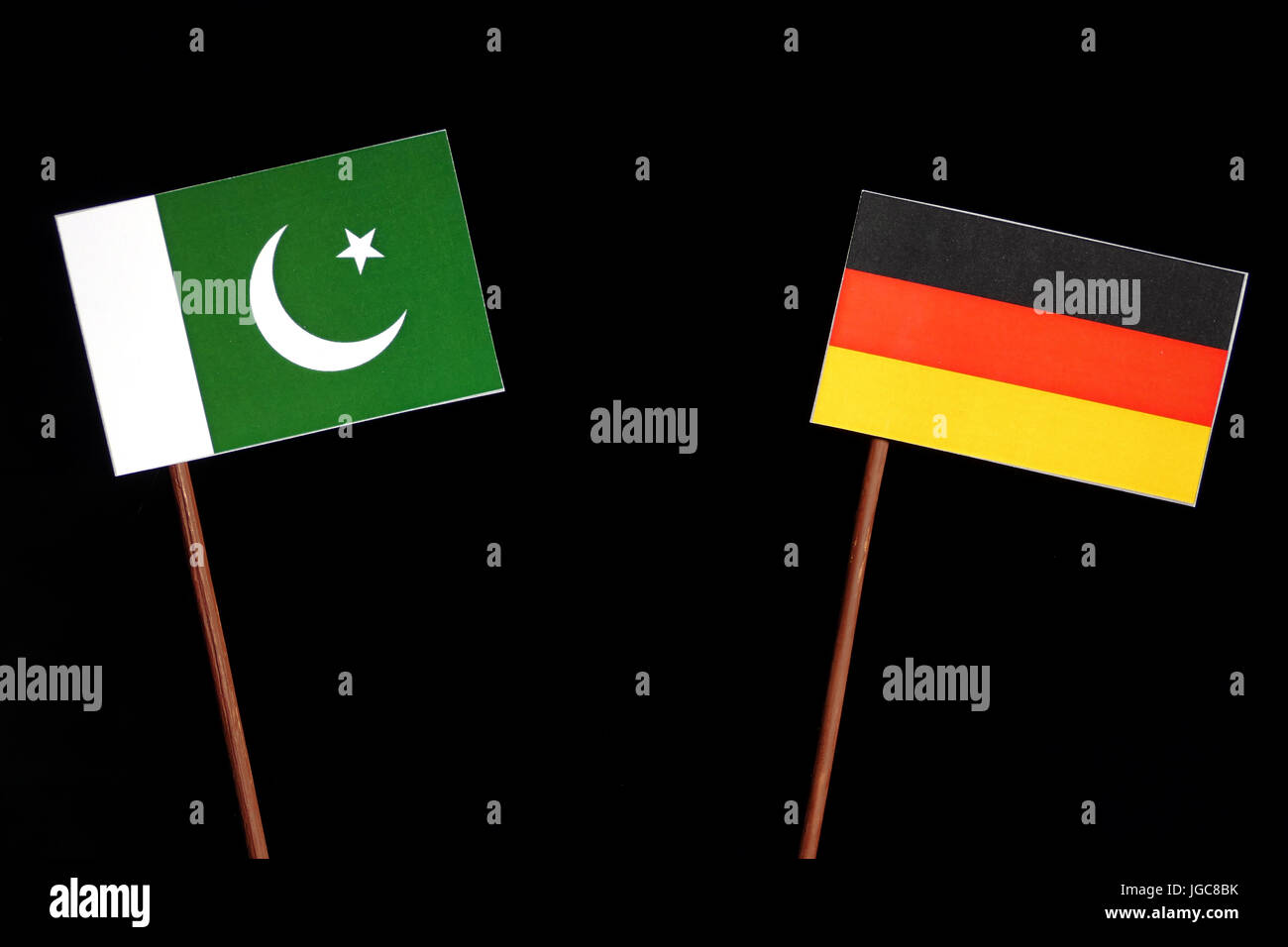 Pakistan flag with German flag isolated on black background Stock Photo ...
