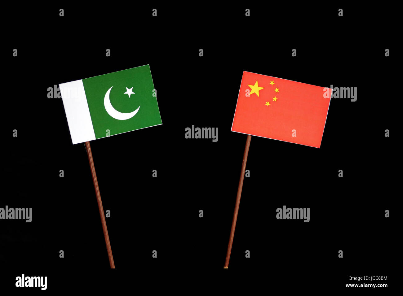 Pakistan flag with Chinese flag isolated on black background Stock ...