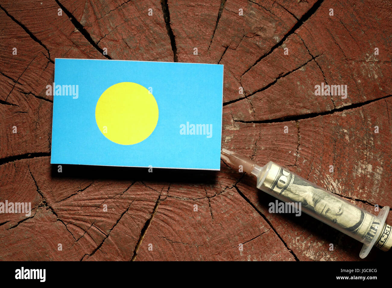 Palau flag on a stump with syringe injecting money in flag Stock Photo ...