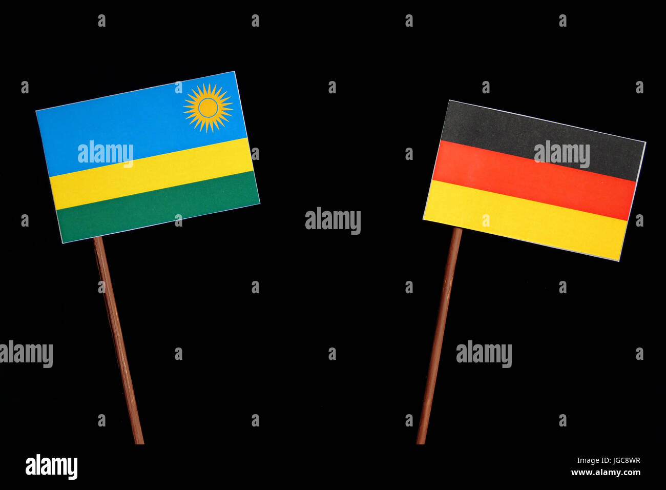 Rwanda flag with German flag isolated on black background Stock Photo ...