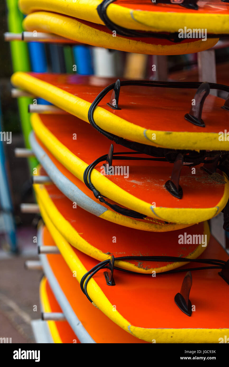 Set of different color surf boards in a stack. France Stock Photo - Alamy