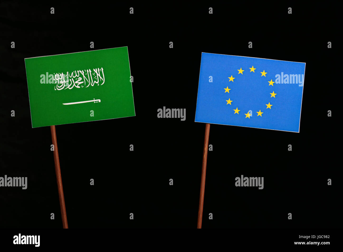 Saudi Arabian flag with European Union (EU) flag isolated on black ...