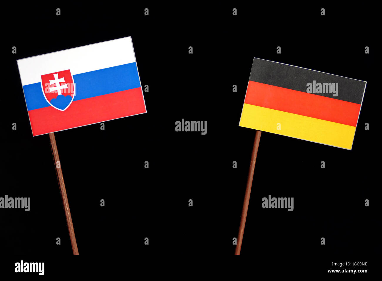 Slovakian flag with German flag isolated on black background Stock ...