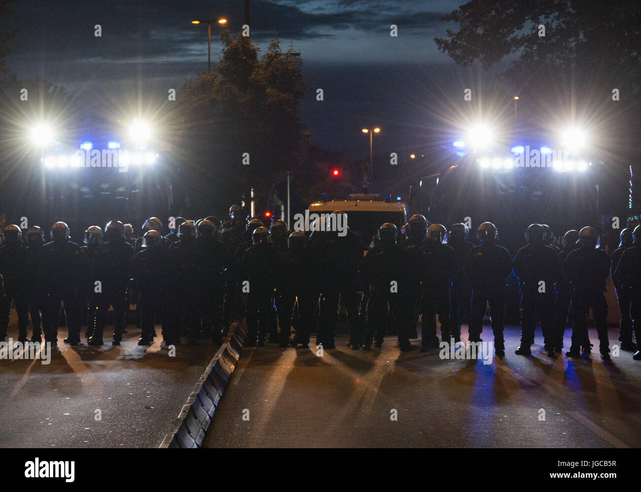 Police officers in riot gear with water cannons in central Hamburg ...