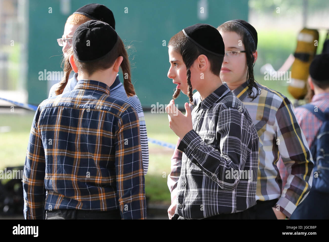 Hackney. London. 5 July 2017 - Children gather around the cordoned off ...