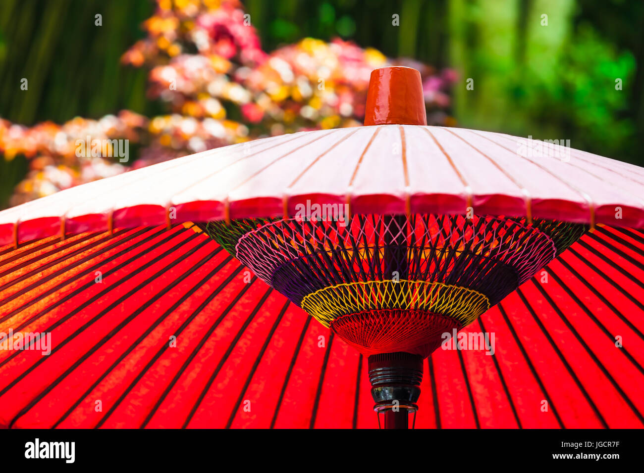 Detail of japanese red paper parasol, colorful blurred background of ...