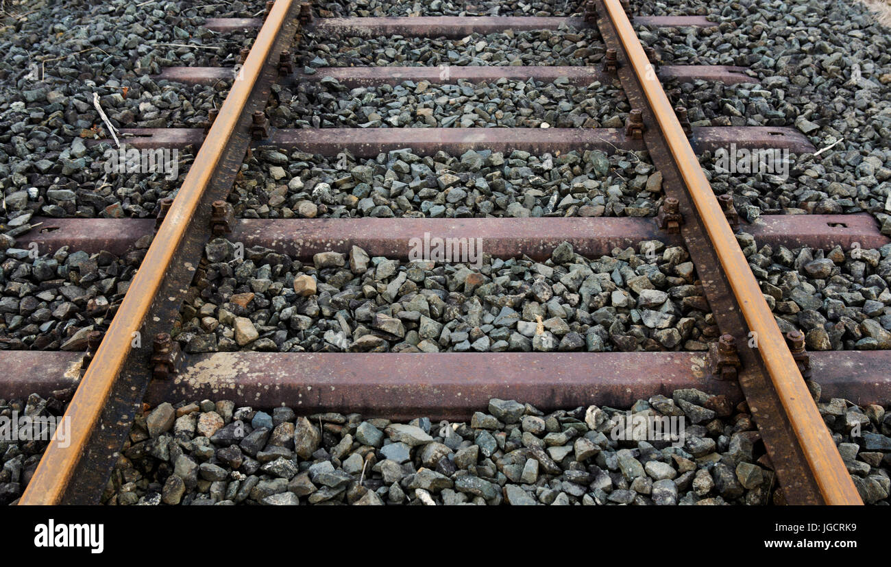 closeup of a train track with stones Stock Photo - Alamy
