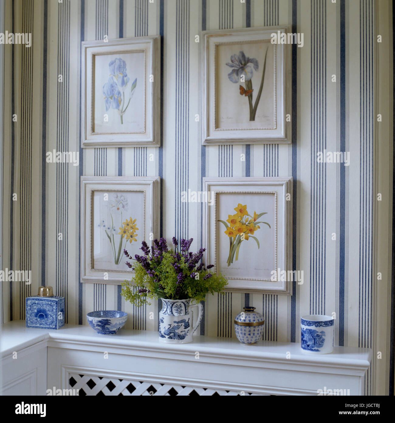 Flower paintings above ledge Stock Photo - Alamy