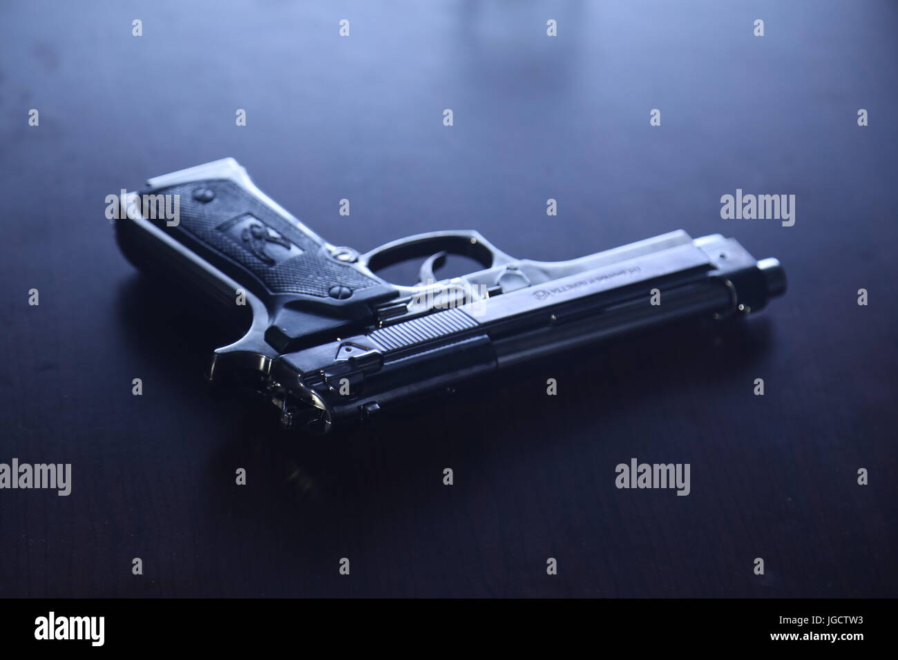 Revolver on the table Stock Photo - Alamy