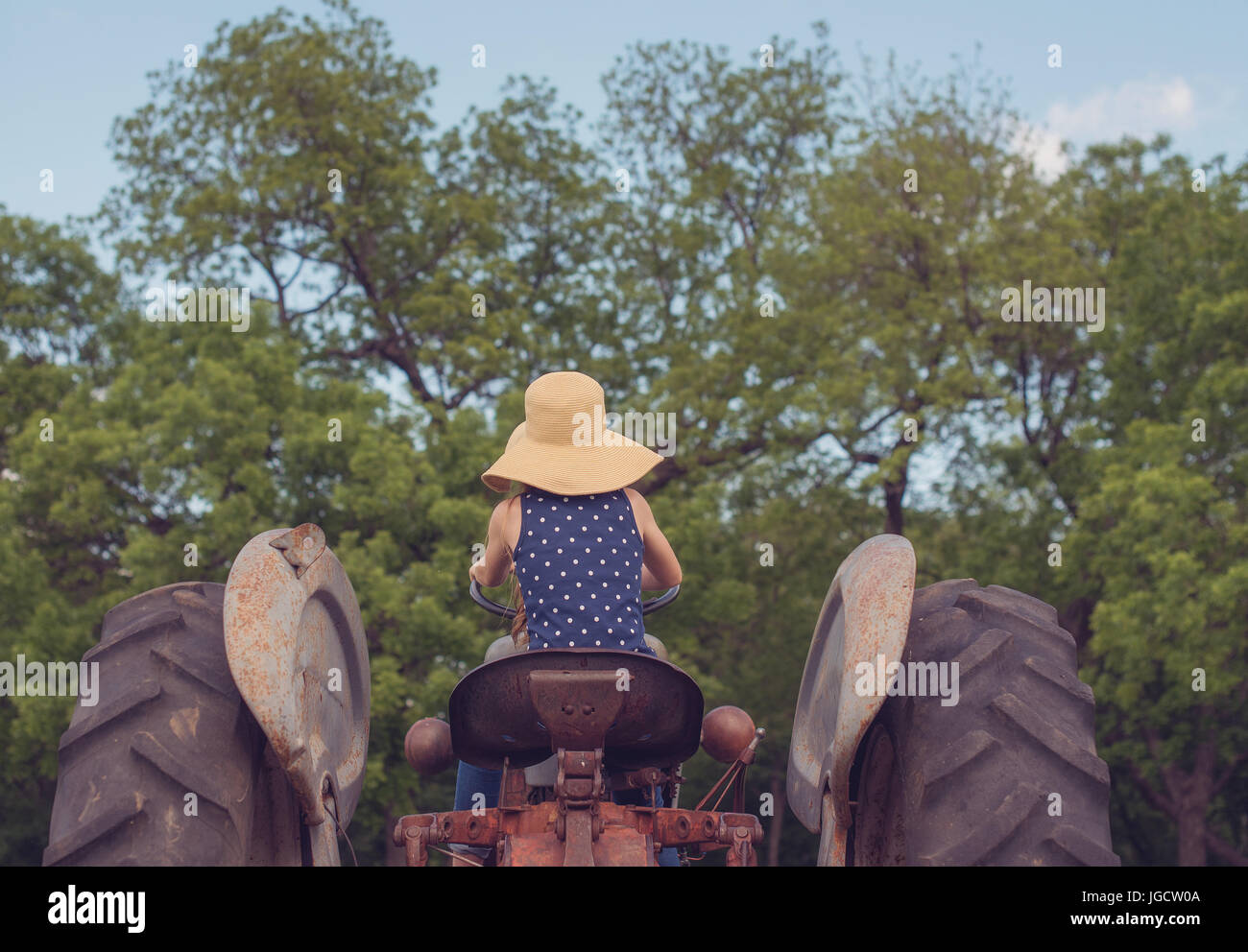 Girl driving tractor hi-res stock photography and images - Alamy