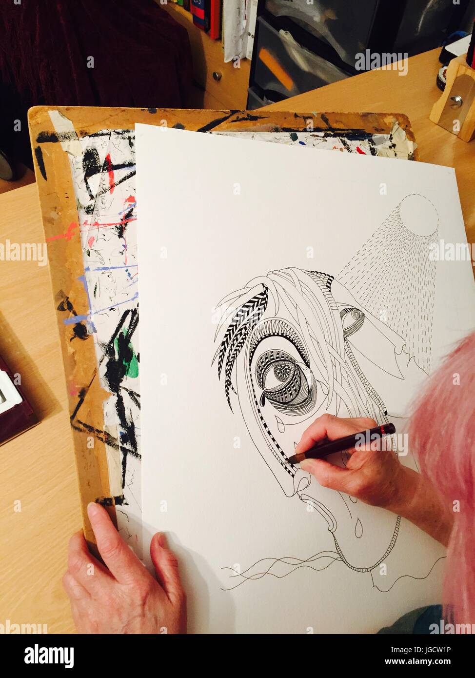 Overhead view of an illustrator drawing Stock Photo - Alamy