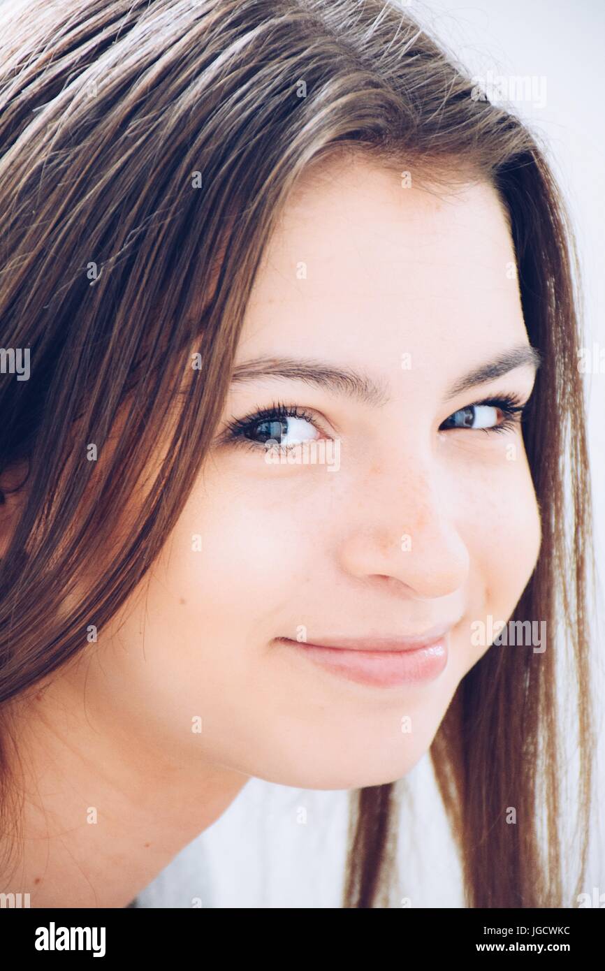 Close-up portrait of a smiling girl Stock Photo - Alamy