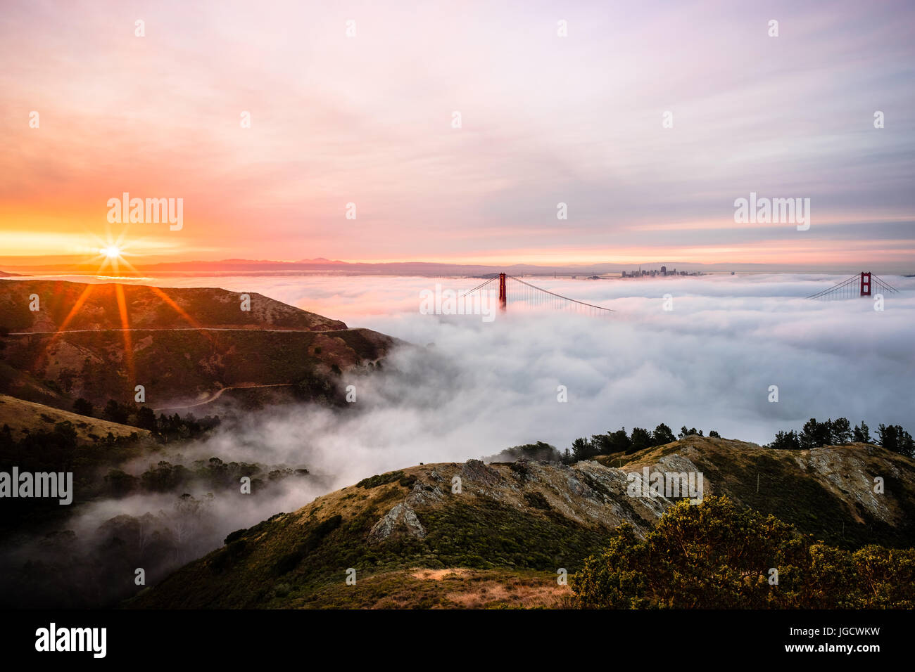 Fog Rolling Over the Golden Gate Bridge at Sunrise, San Francisco ...