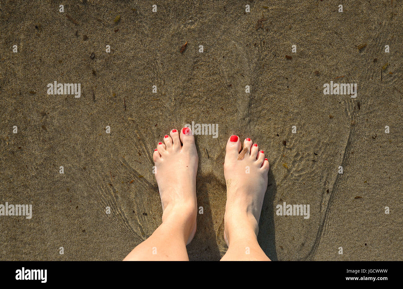 Woman getting toes wet beach hi-res stock photography and images - Alamy