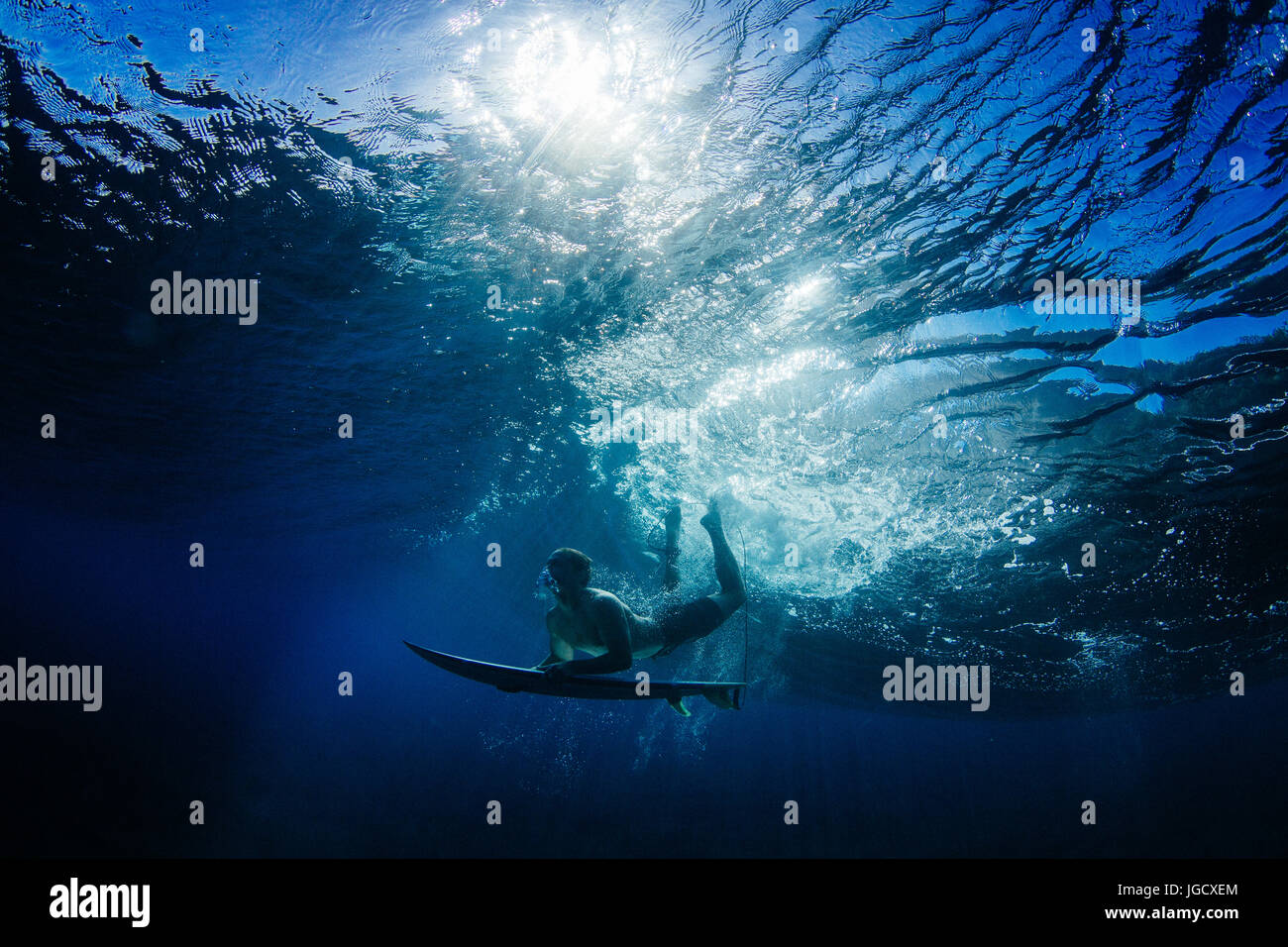 Man Duck Diving under a wave, Hawaii, America, USA Stock Photo - Alamy
