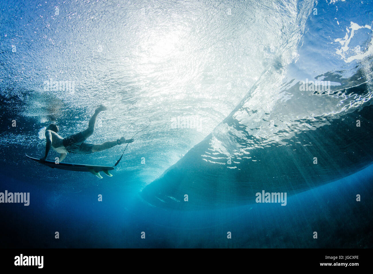 Man Duck Diving under a wave, Hawaii, United States Stock Photo - Alamy