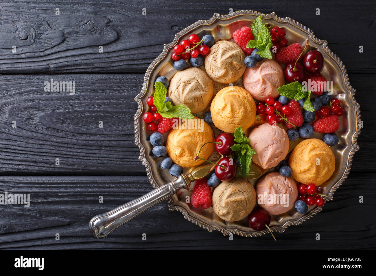 Colorful shortbread cookie with fresh summer berries close-up on the ...