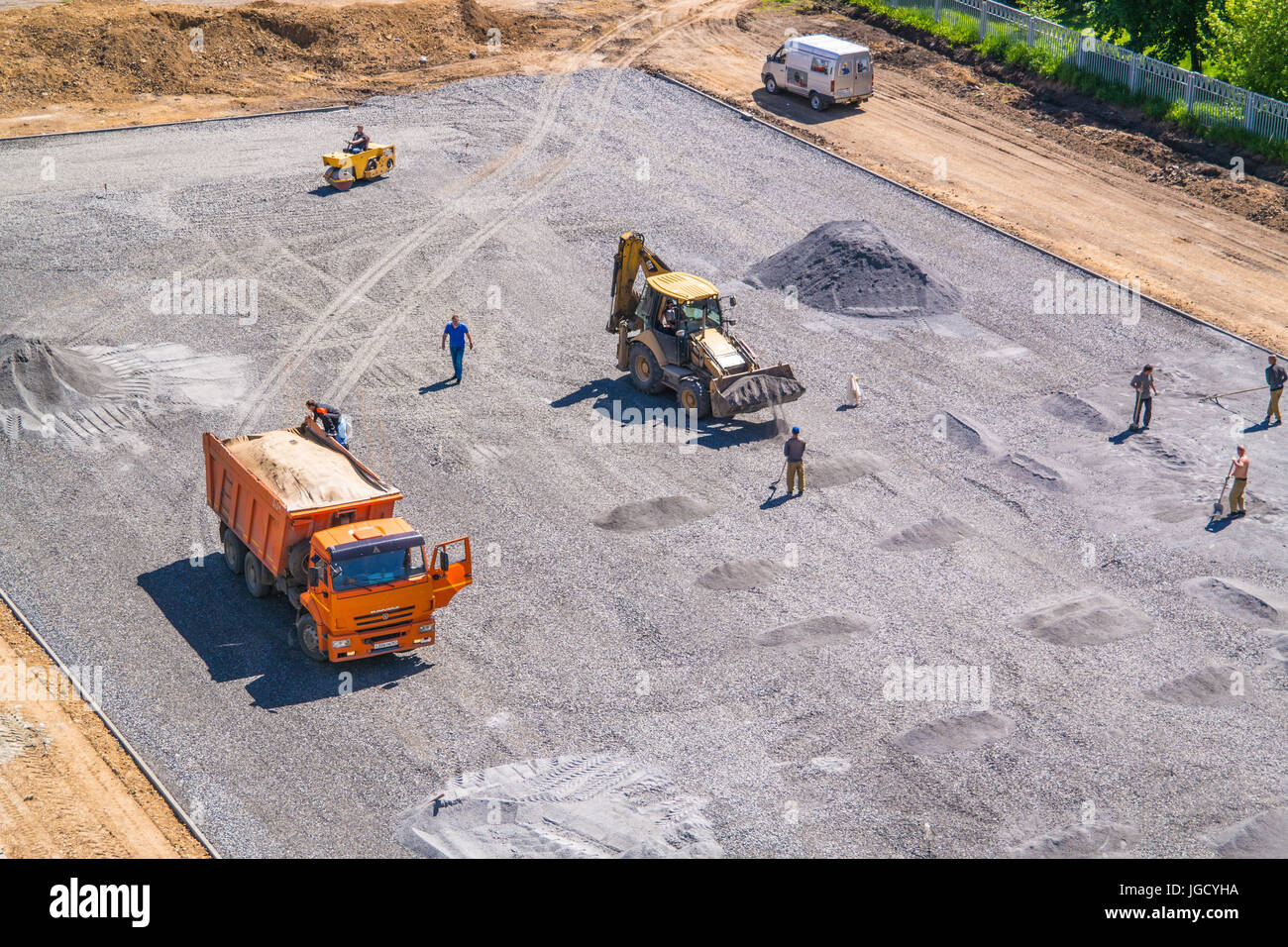 The construction of the school stadium. Excavator, dumper, roller Stock ...